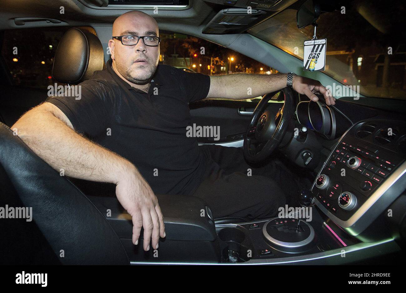Taoufik Moalla poses for a photograph in his car in Montreal, Monday ...