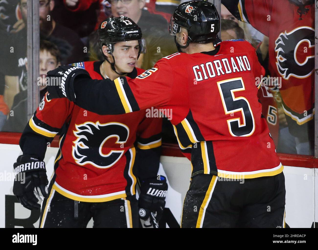 Calgary Flames left wing Johnny Gaudreau (13) celebrates his goal with ...