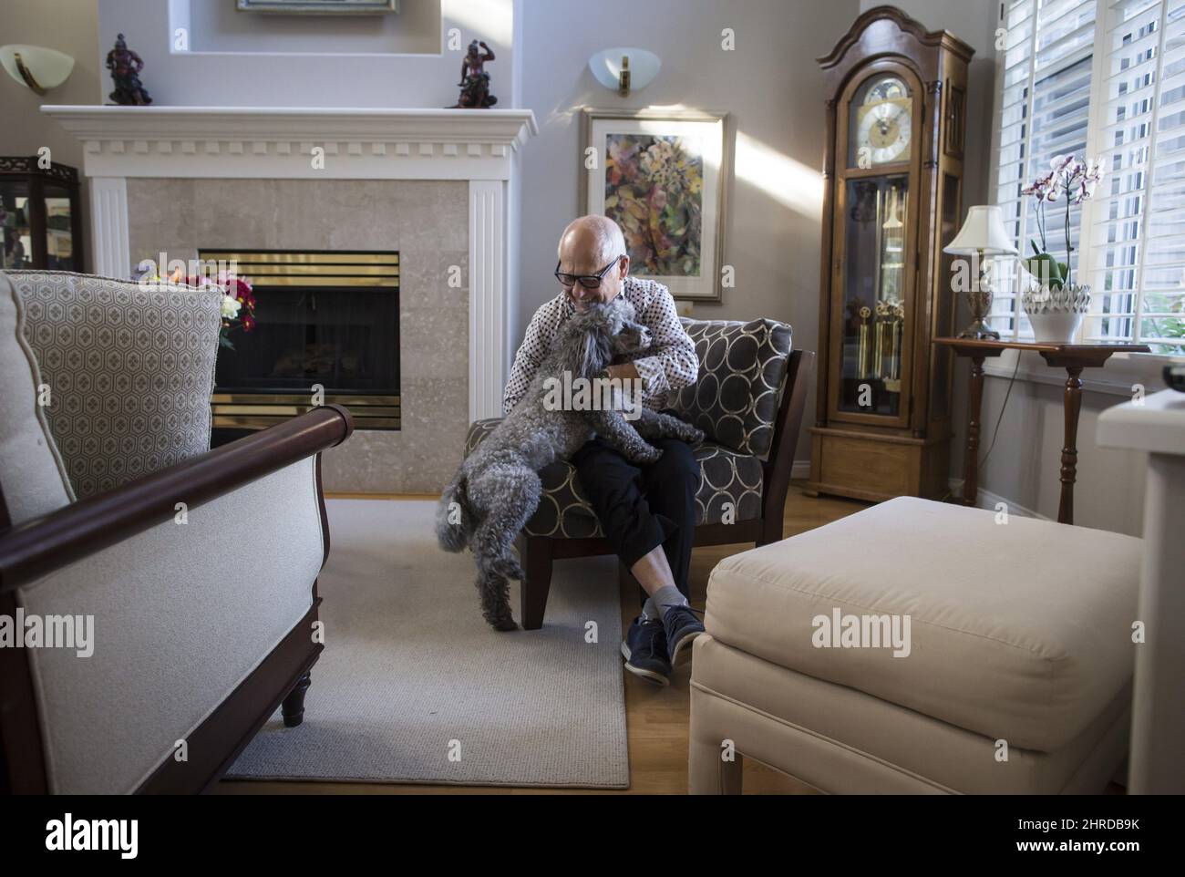 Max Morton, 81, sits with his dog Barney at his home in Richmond, B.C ...