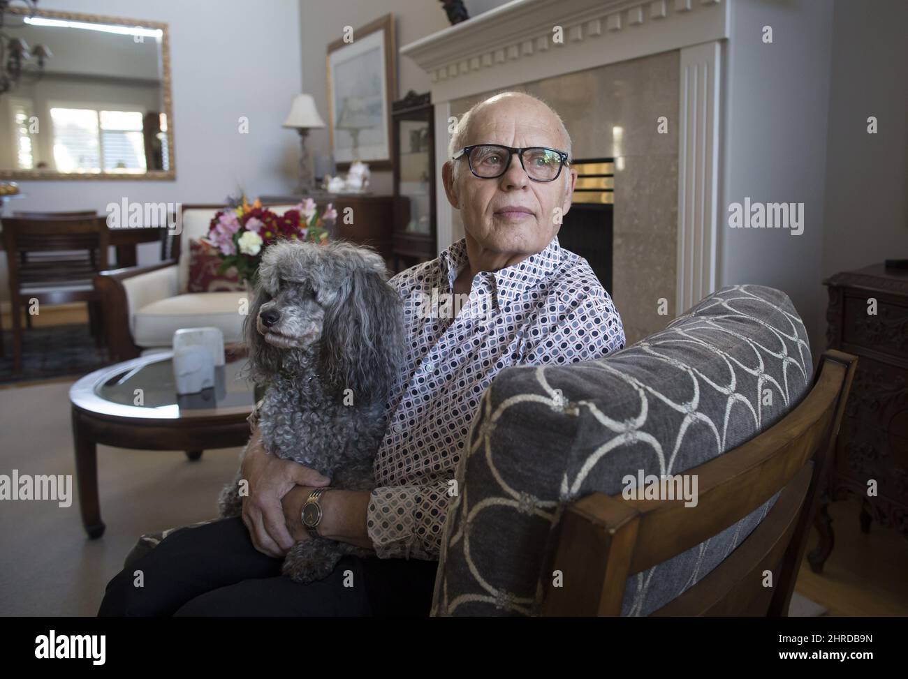 Max Morton, 81, sits with his dog Barney at his home in Richmond, B.C ...