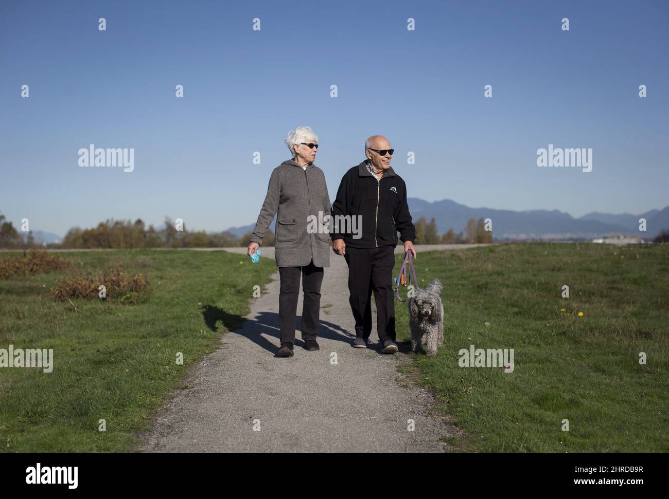 Max Morton and his wife Sharon walk their dog Barney along the Fraser ...