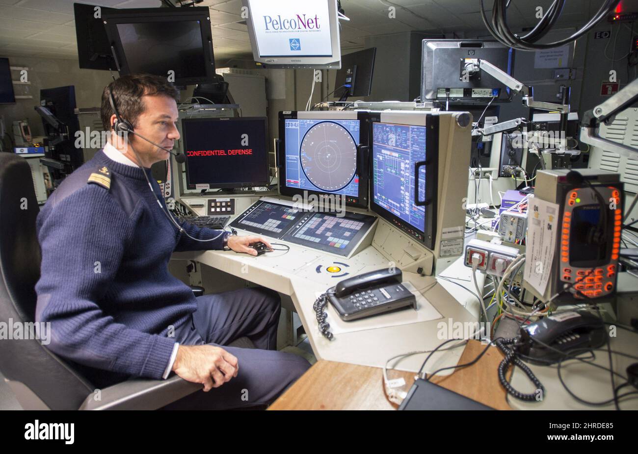 Thomas Fraioli, ship captain of the FS Forbin, sits at his command post ...