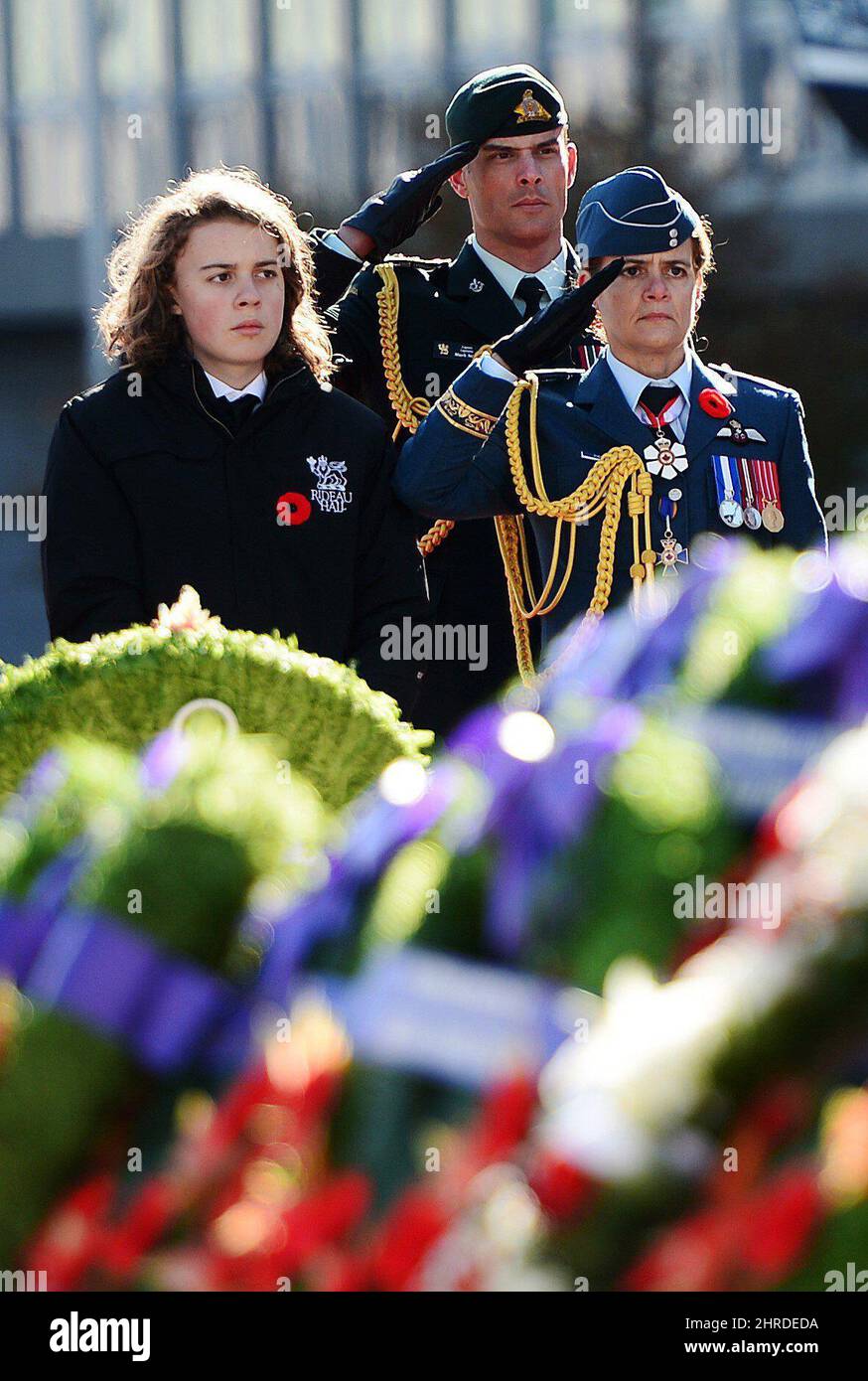 Governor General Julie Payette and her son Laurier Payette-Flynn place a wreath during ...