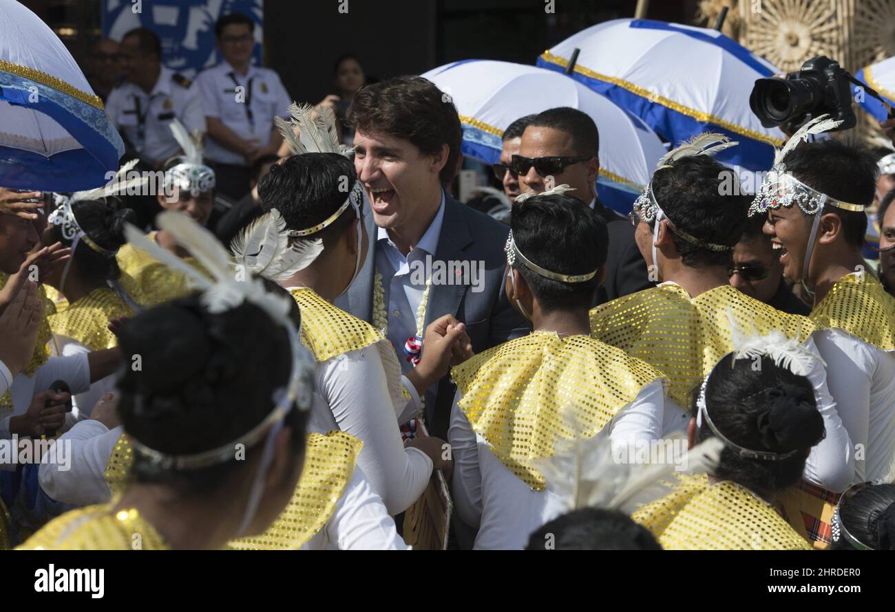 Canadian Prime Minister Justin Trudeau makes his way through dancers on ...