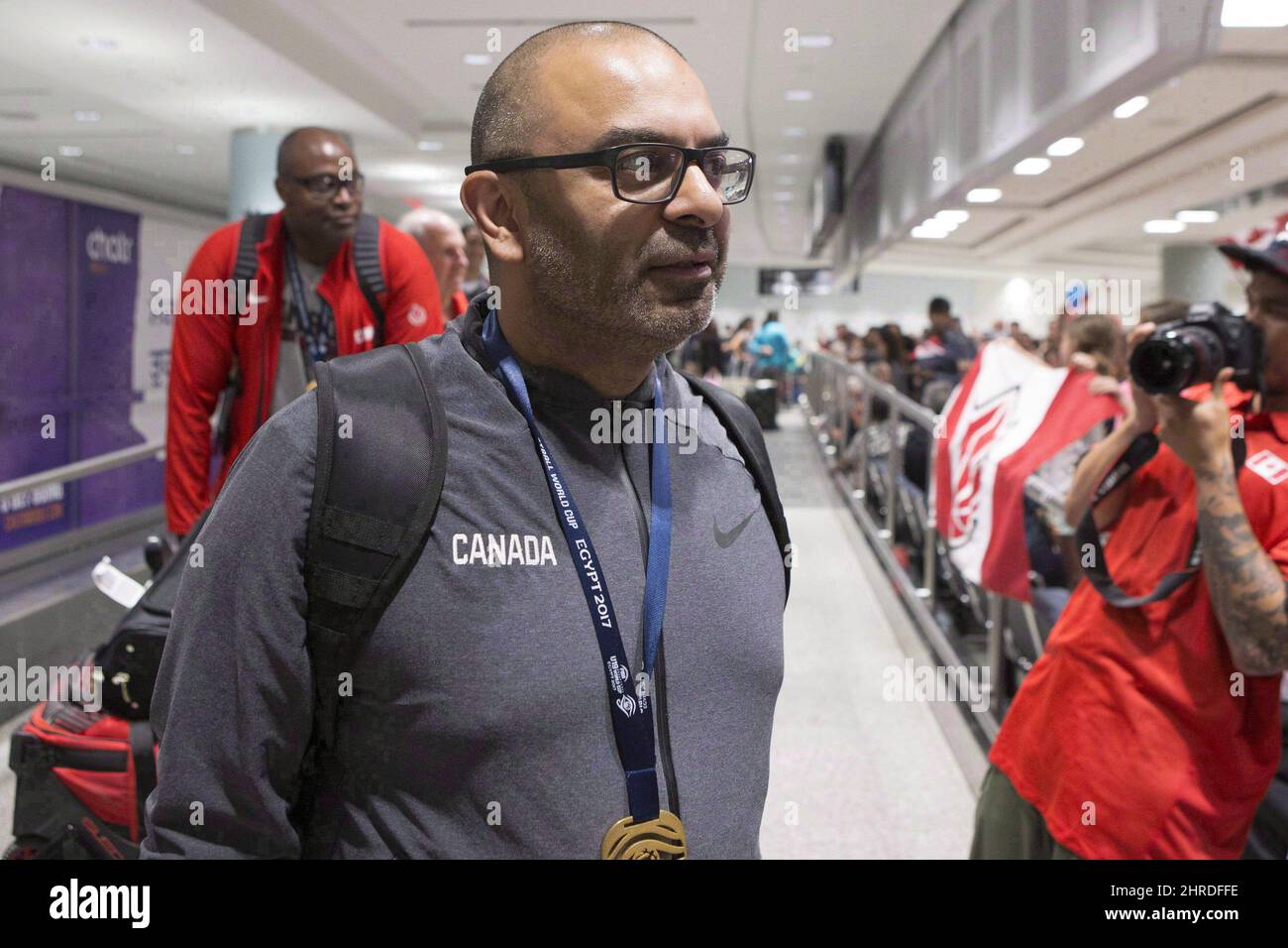 Head coach Roy Rana arrives at Toronto's Pearson Airport with other ...