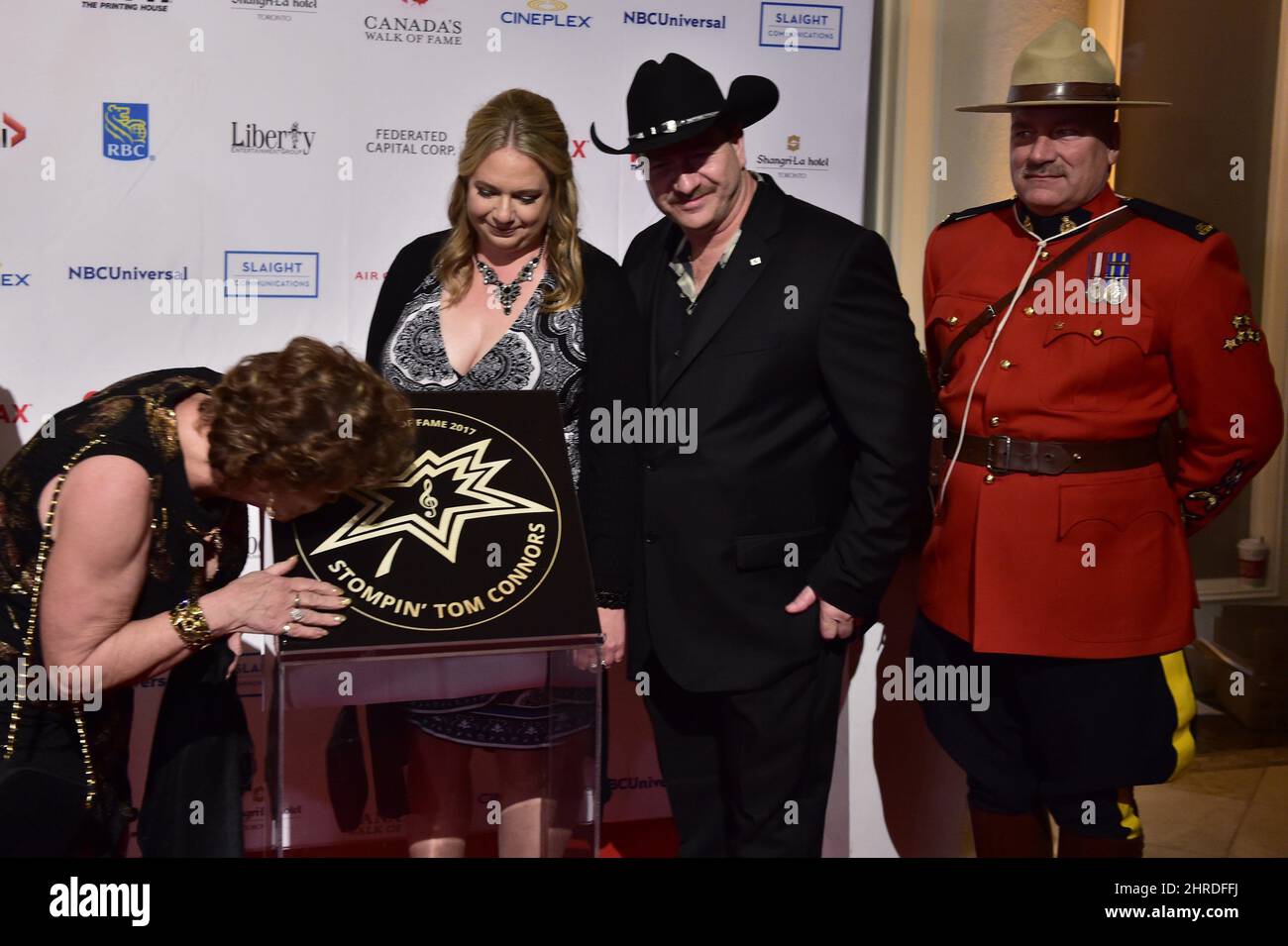 Lena Connors (left), the widow of Stompin' Tom Connors, kisses the late ...