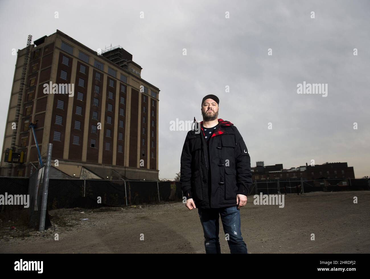 Jason Paris poses for a photograph at the building site of where his ...