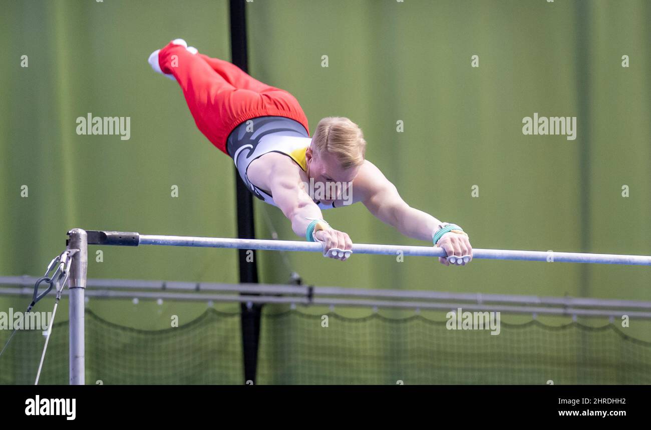 Cottbus, Germany. 25th Feb, 2022. Gymnastics: World Cup, men: high bar ...