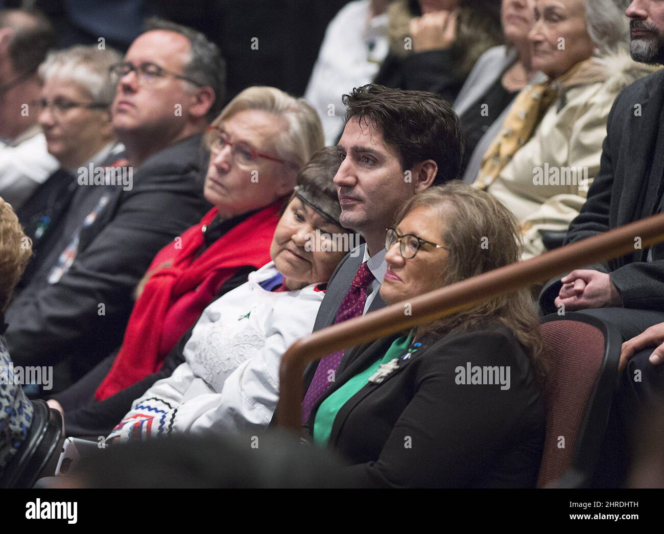 Prime Minister Justin Trudeau sits in the crowd before he delivered an ...