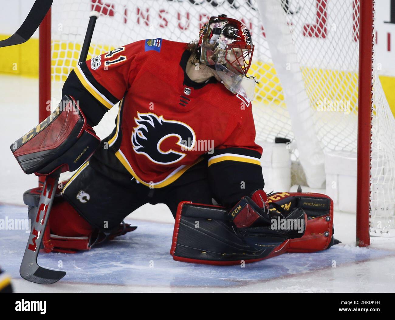 Calgary Flames goalie Mike Smith looks back at the net after the ...