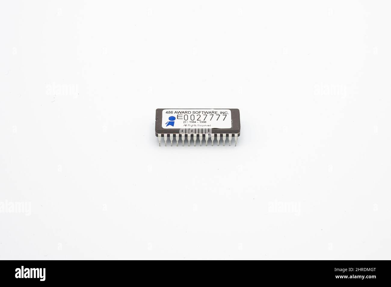 Closeup of a read-only memory chip on the white surface with space for ...