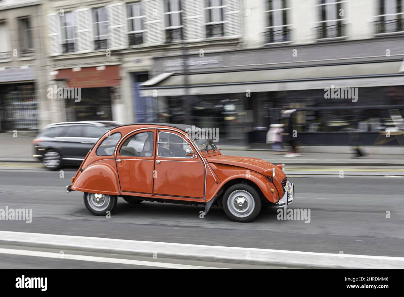 Classic red colored Citroen 2CV car driving on the street Stock Photo ...