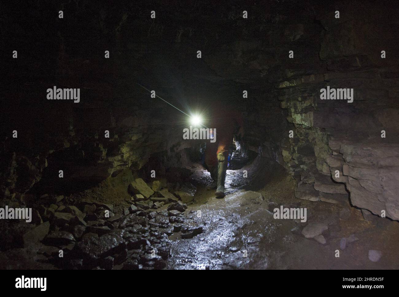 Cave explorer Daniel Caron explores a cave under a park in Montreal ...
