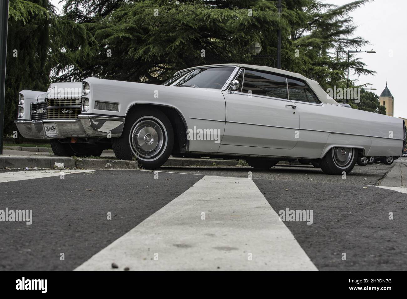 White retro Cadillac Deville classic car parked on a street Stock Photo ...