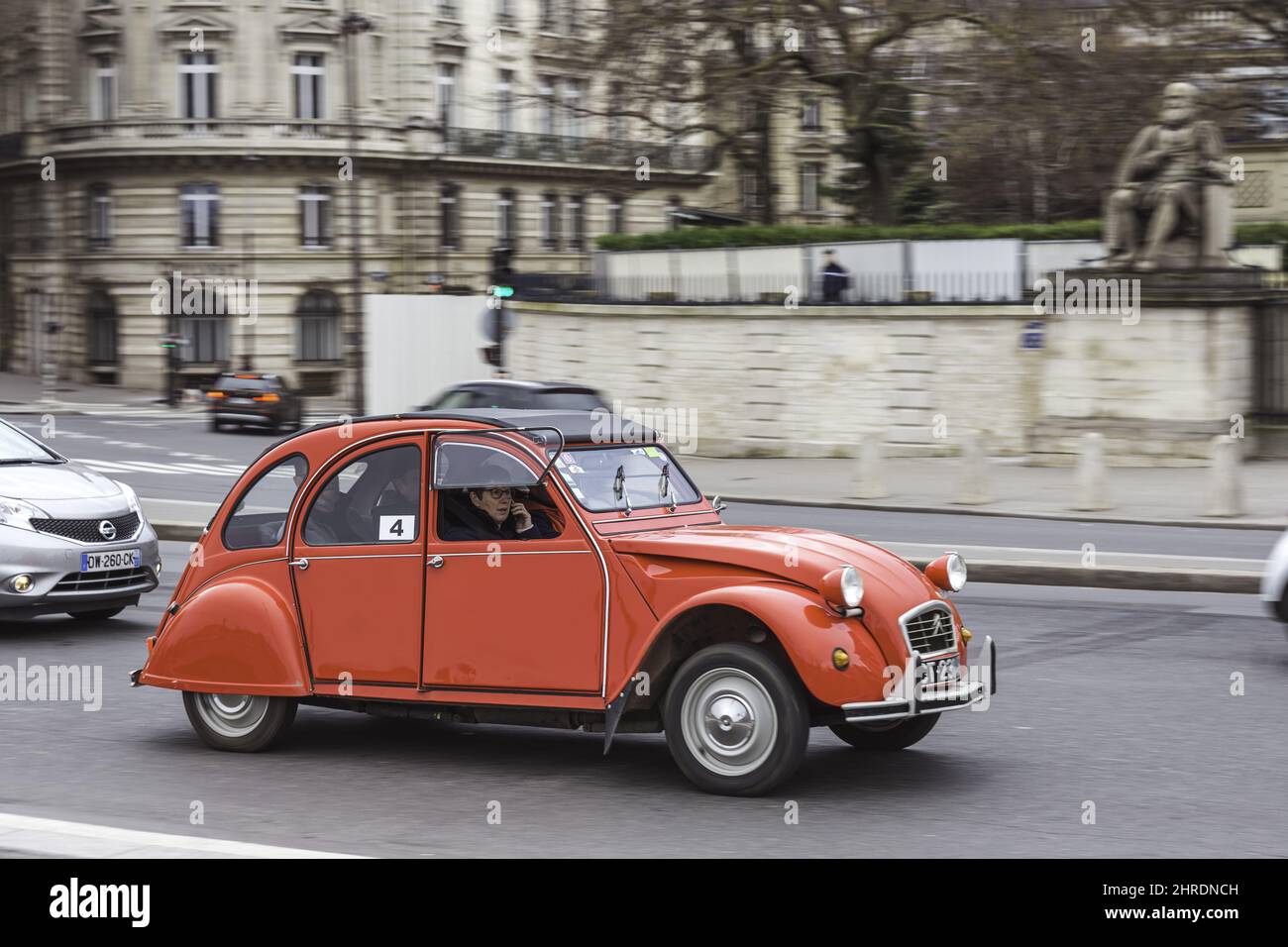 Classic red colored Citroen 2CV car driving on the street Stock Photo ...