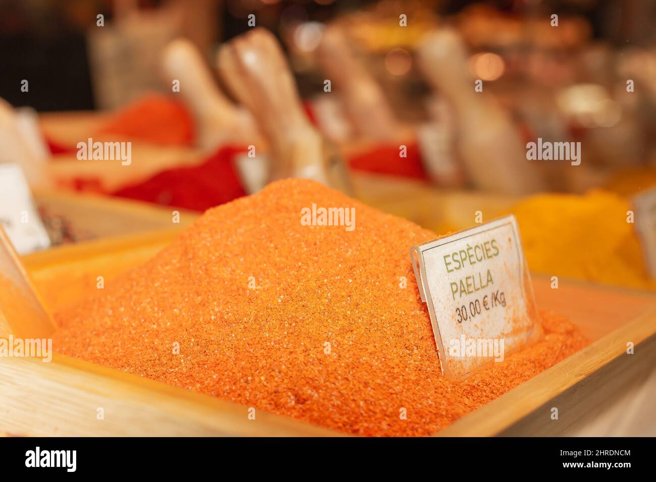 Spicy spice seasoning for paella in wooden container Stock Photo - Alamy