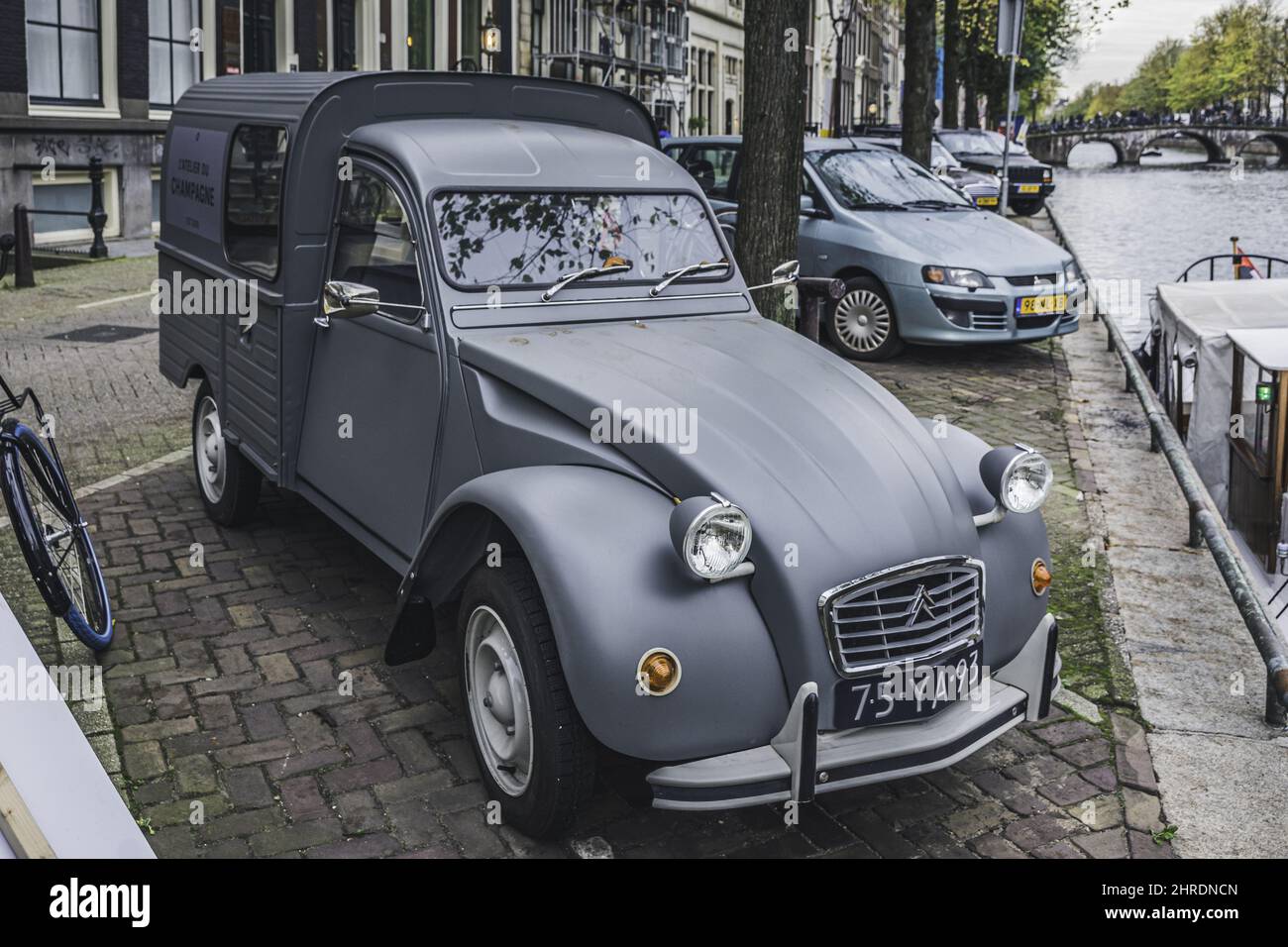 Classic gray colored Citroen 2CV van driving on the street Stock Photo ...