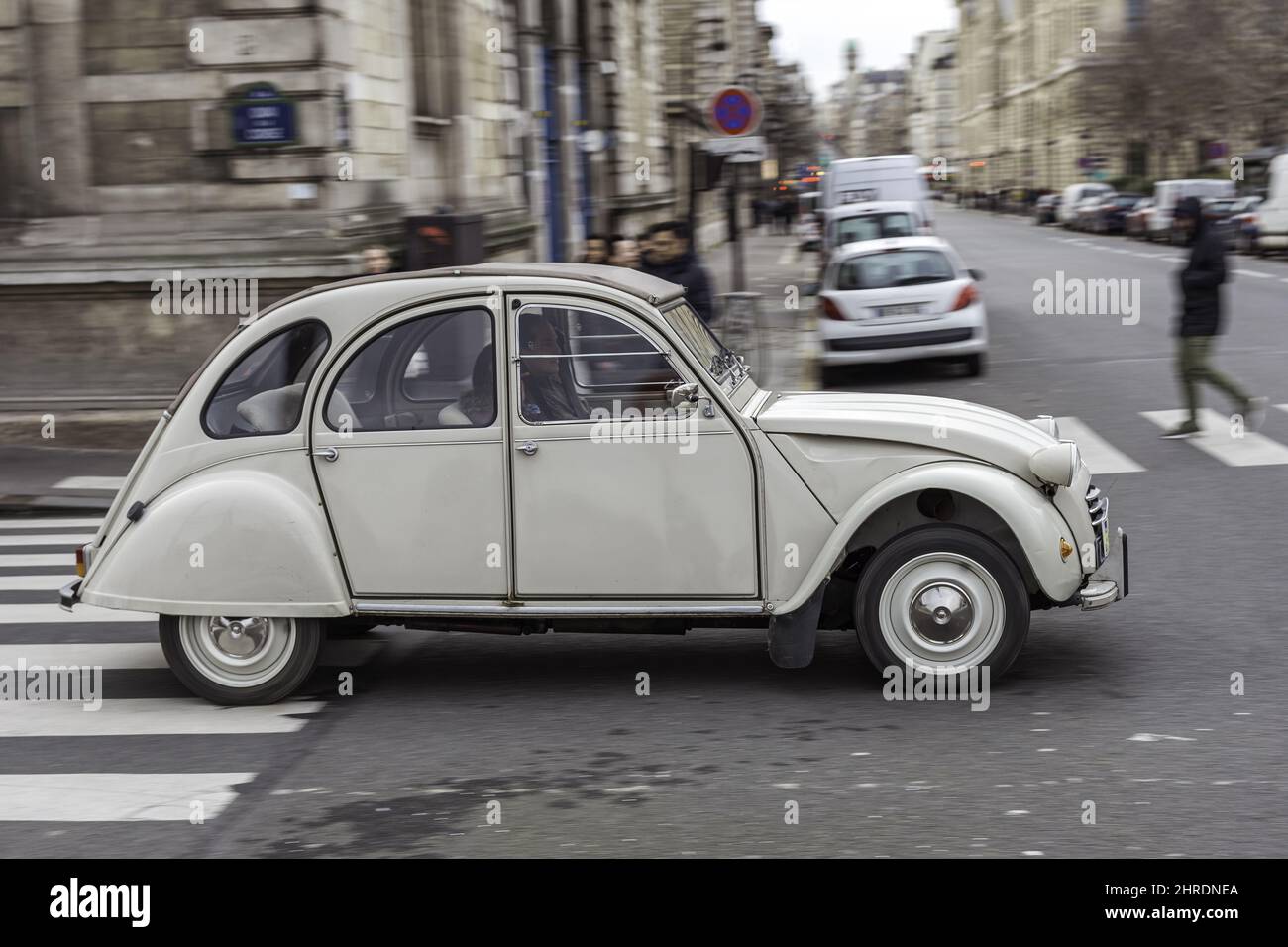 Classic white colored Citroen 2CV car driving on the street Stock Photo ...