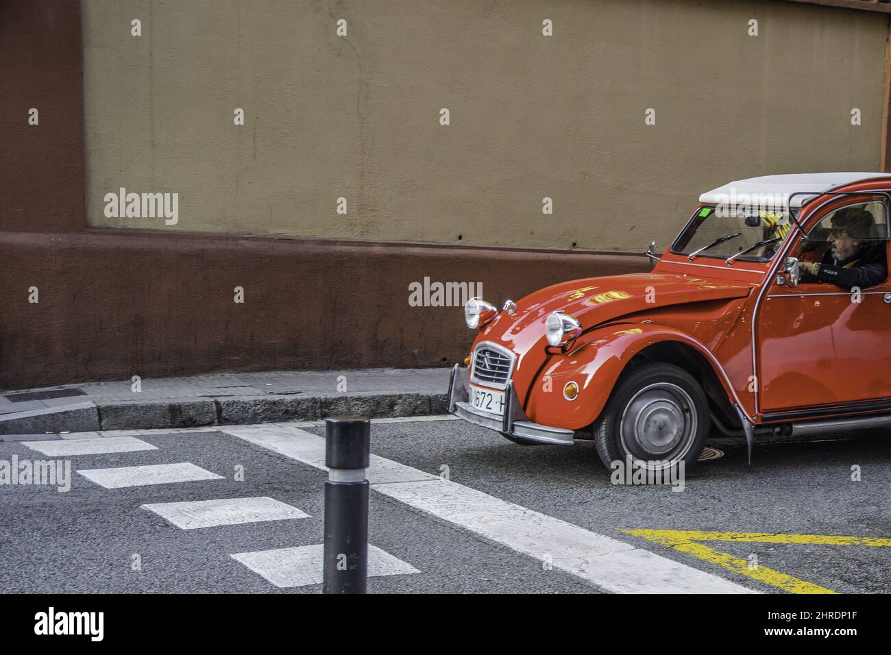 Classic red colored Citroen 2CV car driving on the street Stock Photo ...