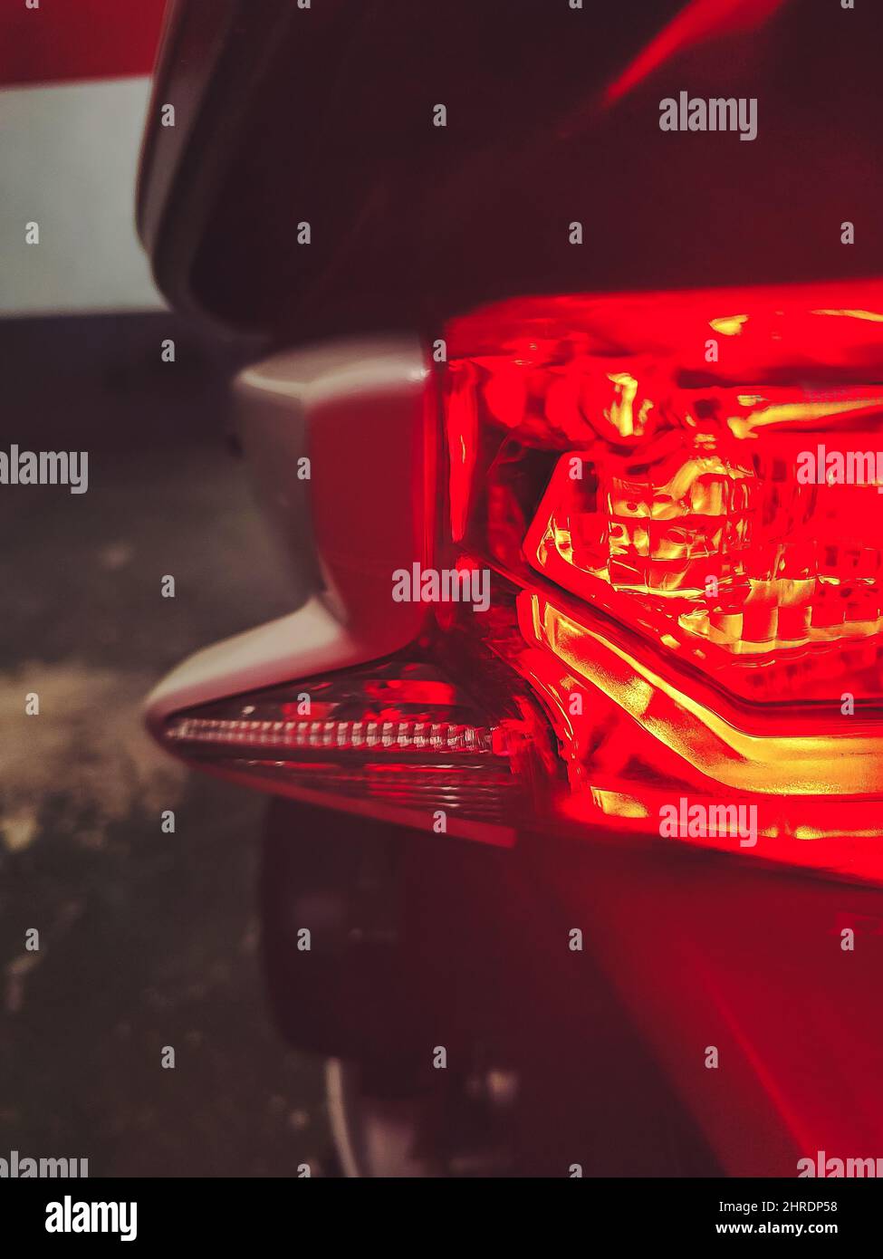 Vertical shot of a red headlight of a modern car Stock Photo - Alamy