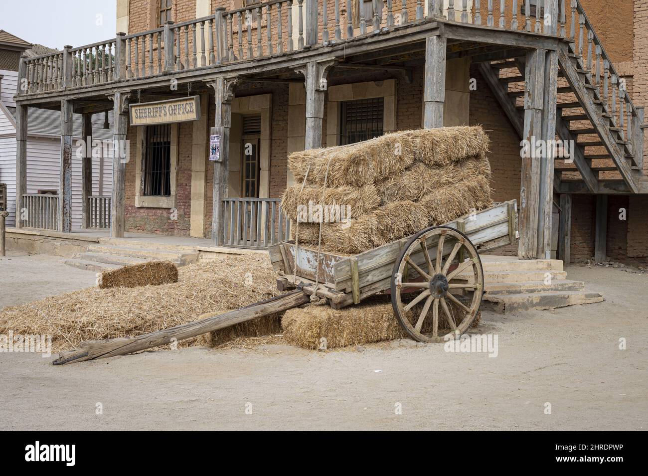 Old one axle straw bale wagon in the wild west pub Stock Photo - Alamy