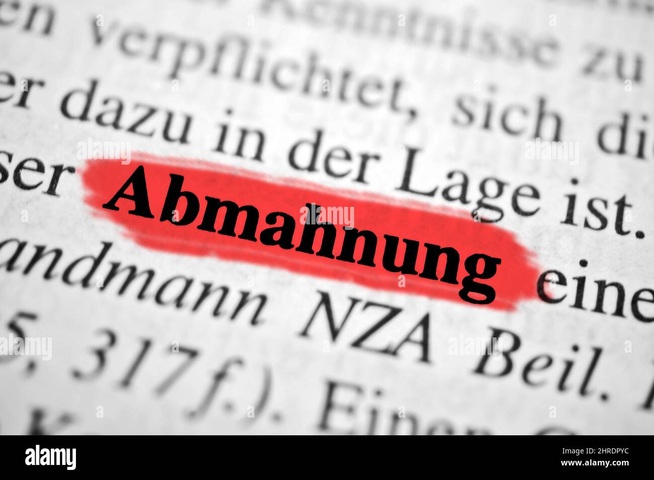 Closeup of the word "Warning" highlighted in red on the page Stock ...