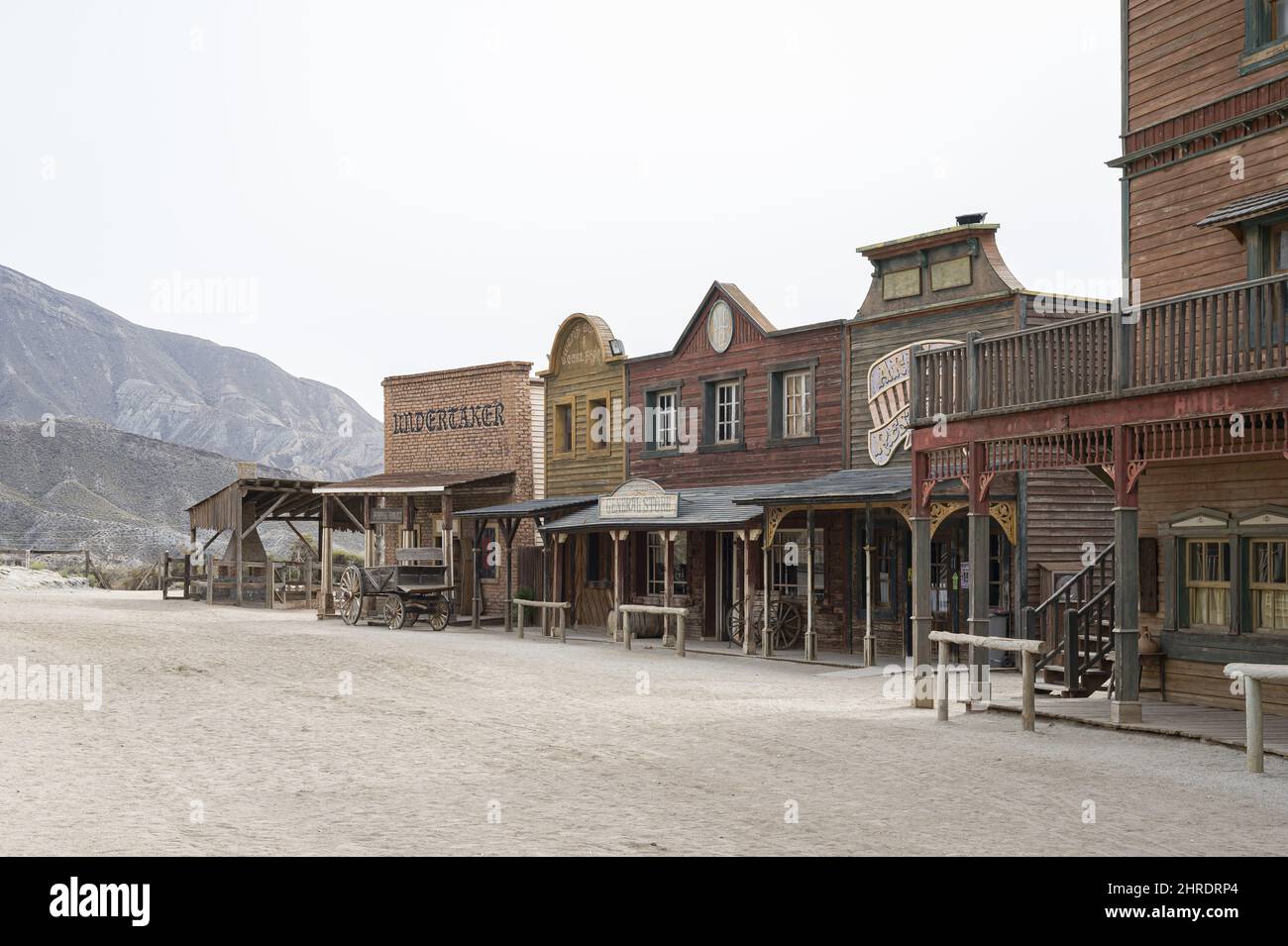 Wild west town landscape with an empty road Stock Photo - Alamy