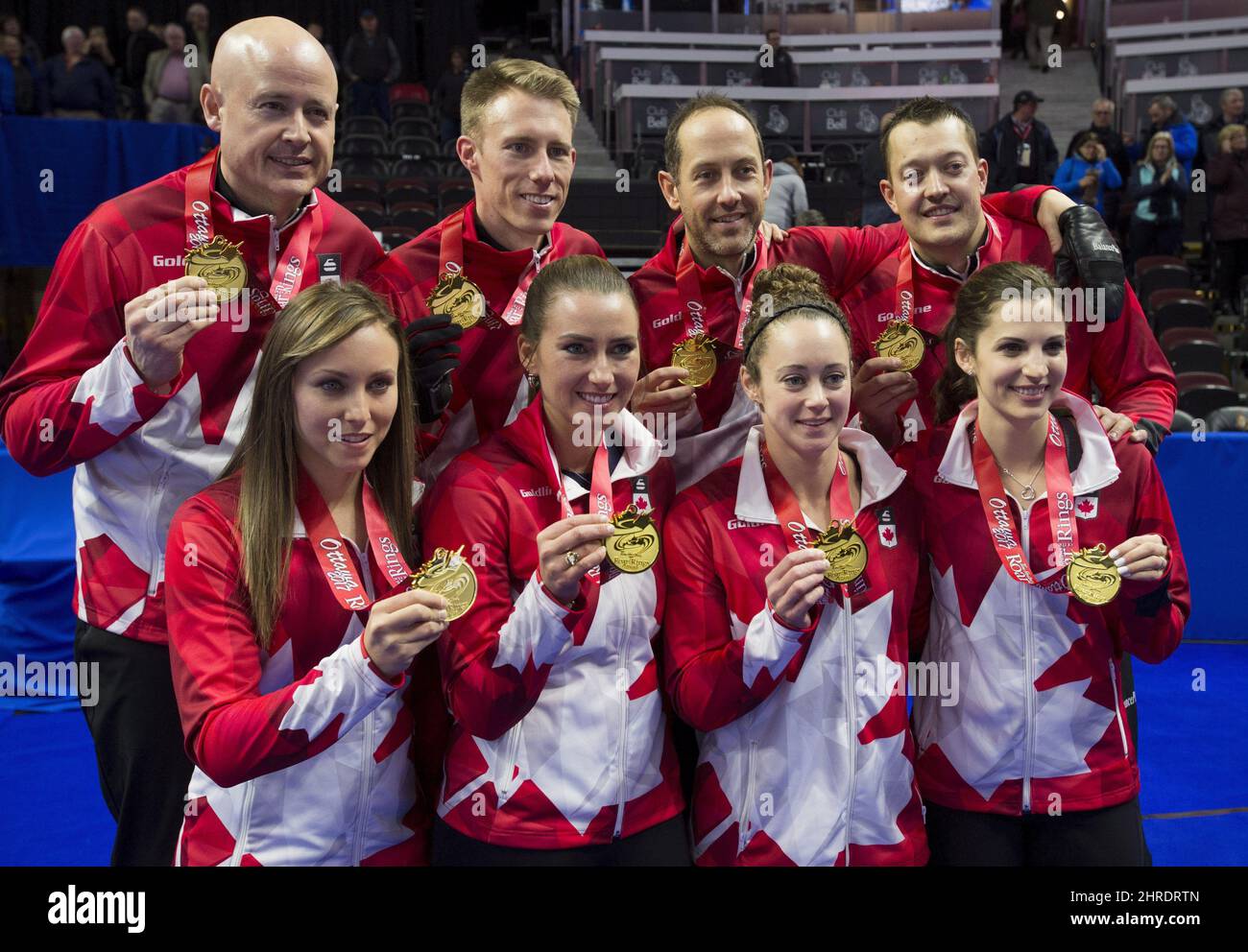 Team Koe and Team Homan pose with their medals following the Olympic ...