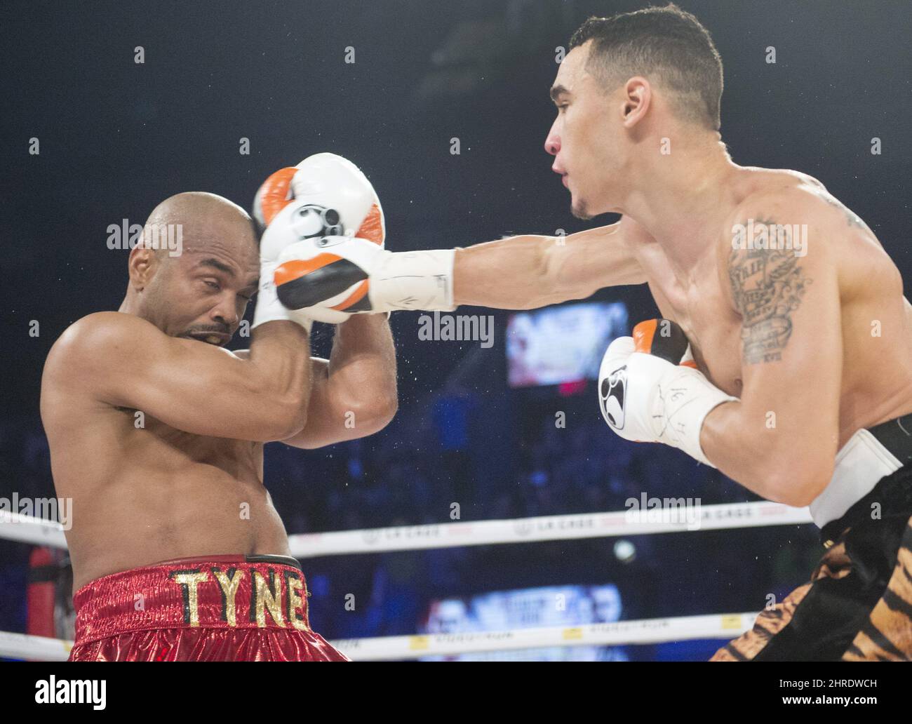 Steven Butler, right, of Montreal, throws a right to the head of Tyner ...