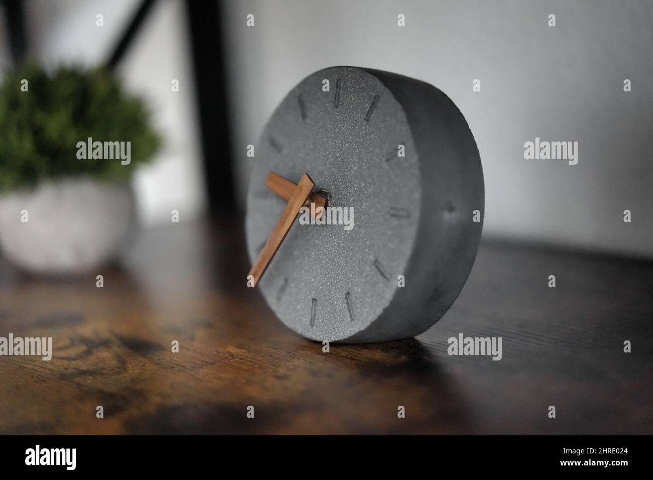Closeup of a modern desk watch with a unique design Stock Photo - Alamy