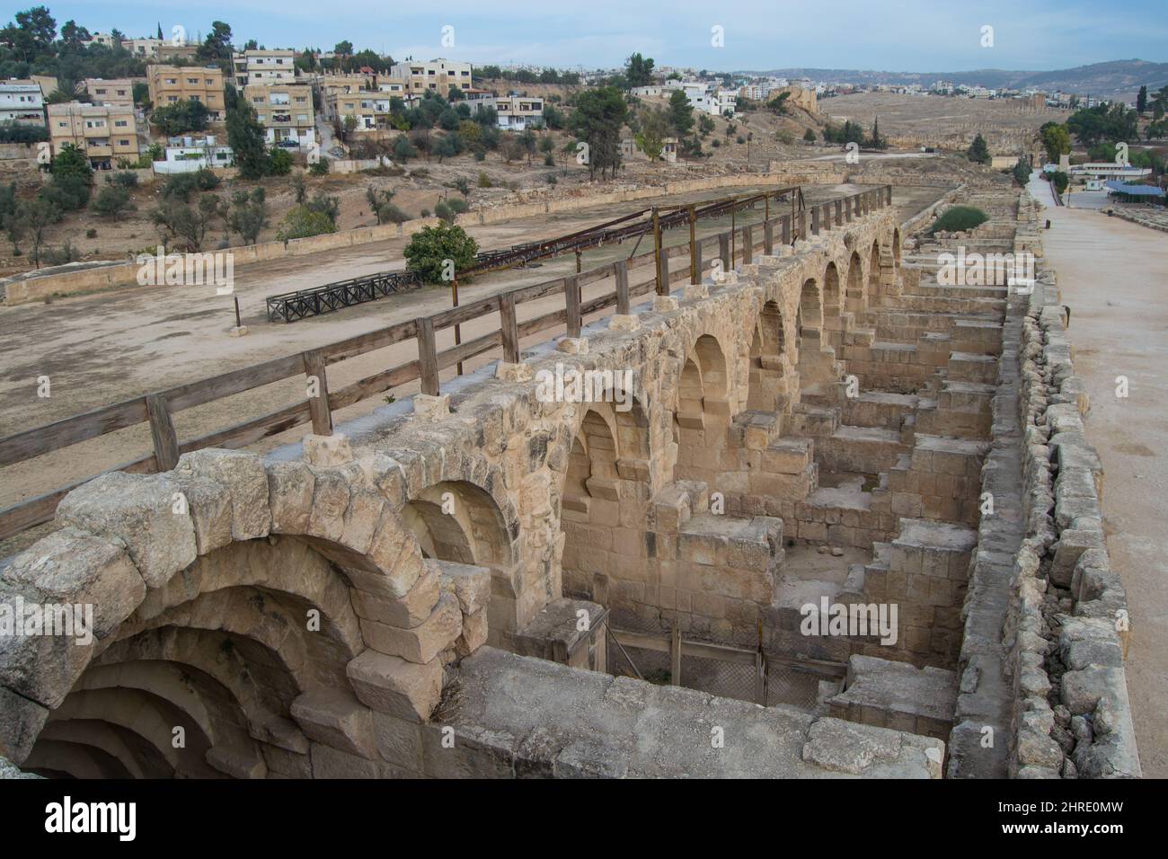 Old stone bridge linking modern and ancient Jerash. Archaeological Site ...