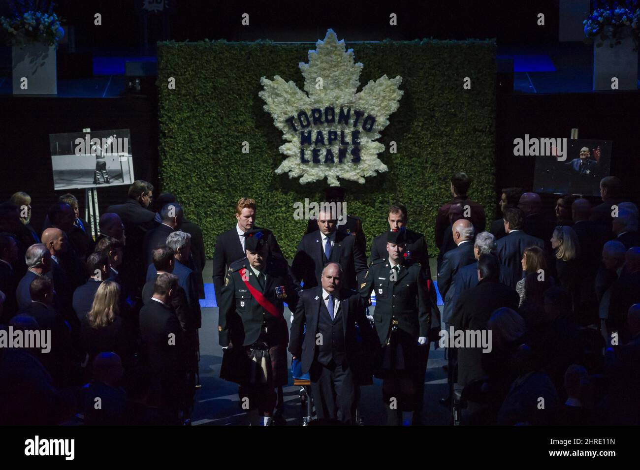 Canadian hockey legend Johnny Bower's casket is carried out by ...