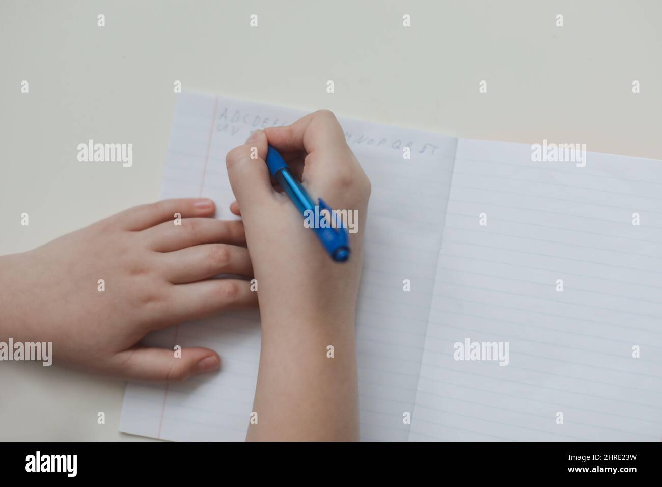 Child open book above desk hi-res stock photography and images - Alamy