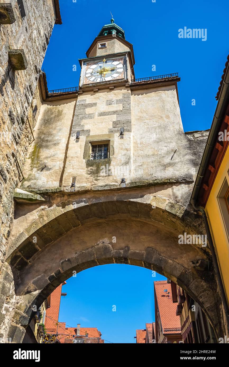 Vertical bottom shot of a clocktower in the daytime Stock Photo - Alamy