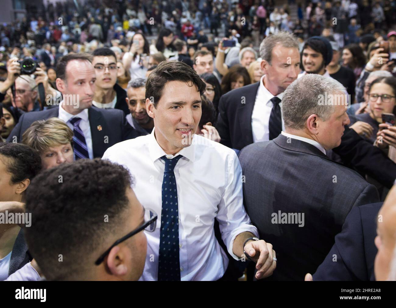 Prime Minister Justin Trudeau, centre, leaves the room as his RCMP ...