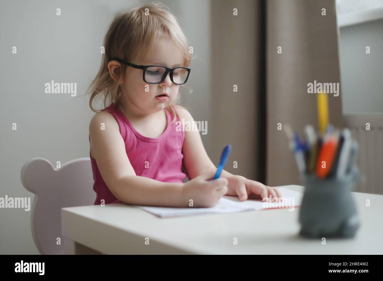 Smart little girl writing drawing hi-res stock photography and images ...