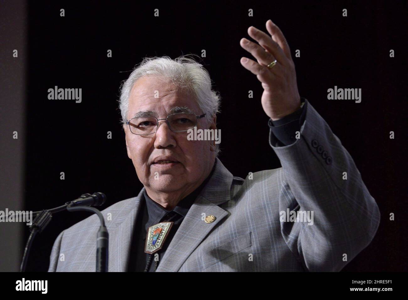 Commission chairman Justice Murray Sinclair raises his arm asking ...