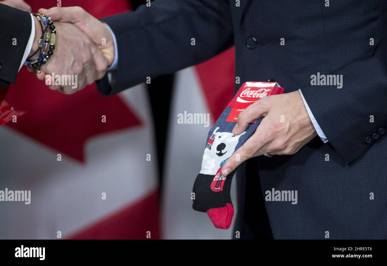 Prime Minister Justin Trudeau gets a pair of polar bear socks from ...