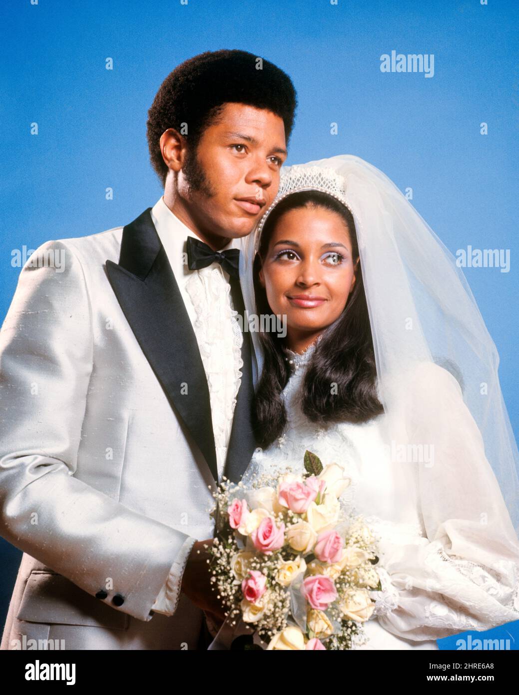 1970s PORTRAIT AFRICAN AMERICAN BRIDE AND GROOM BRIDE HOLDING ROSE ...