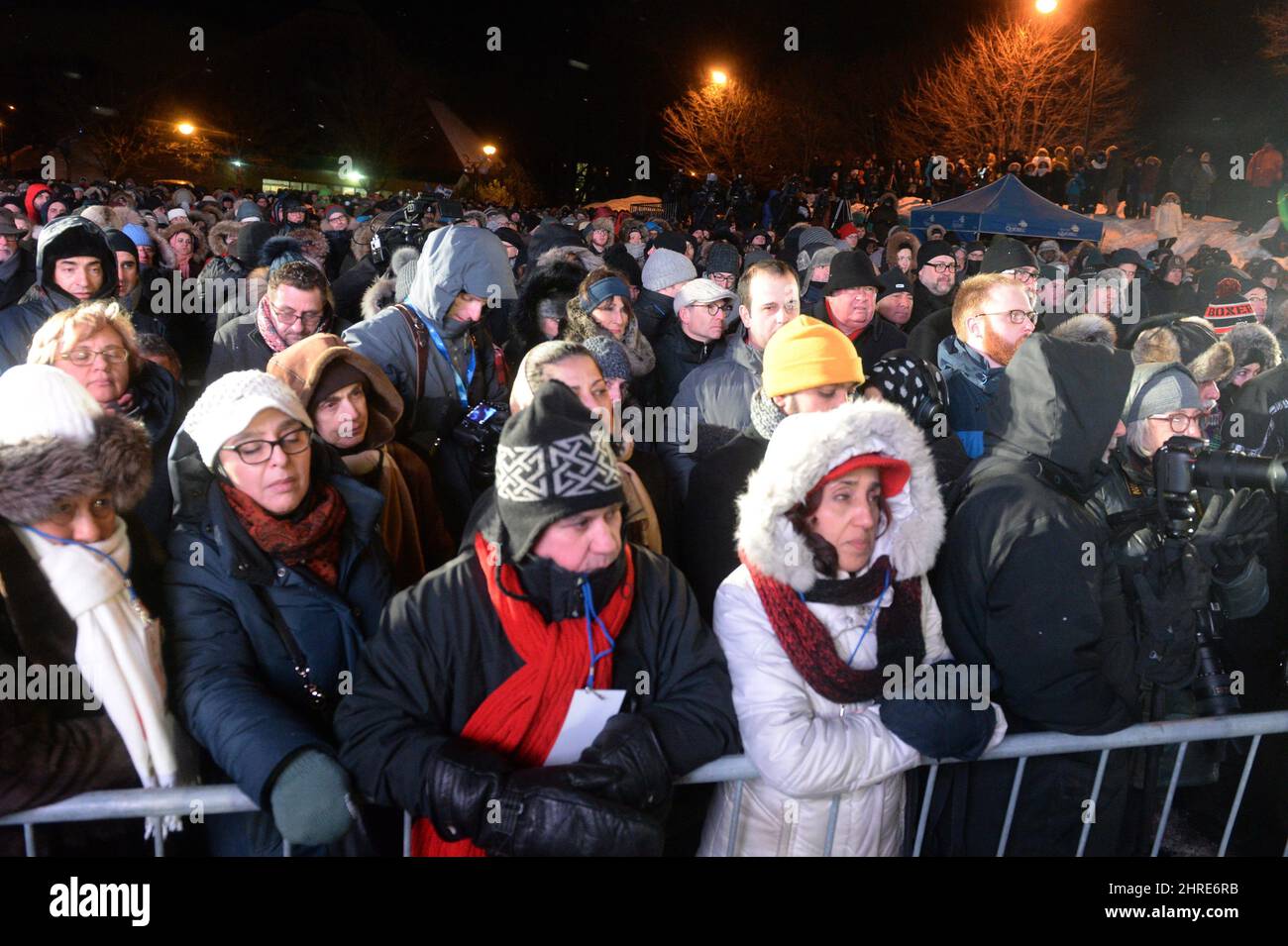 People attend a vigil to commemorate the one-year anniversary of the ...
