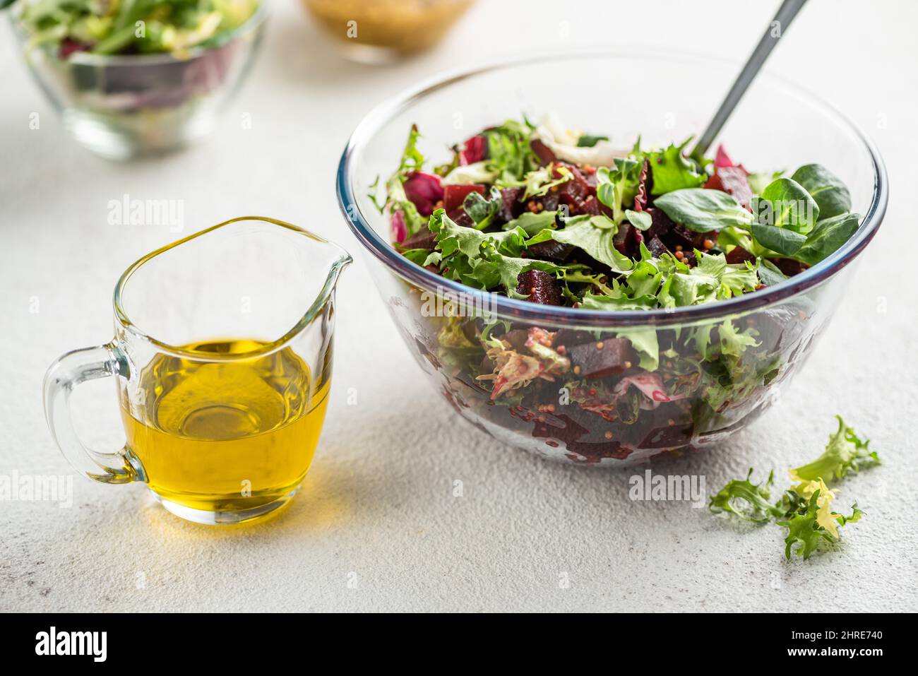 Beet salad with oil and greens. White background Stock Photo - Alamy