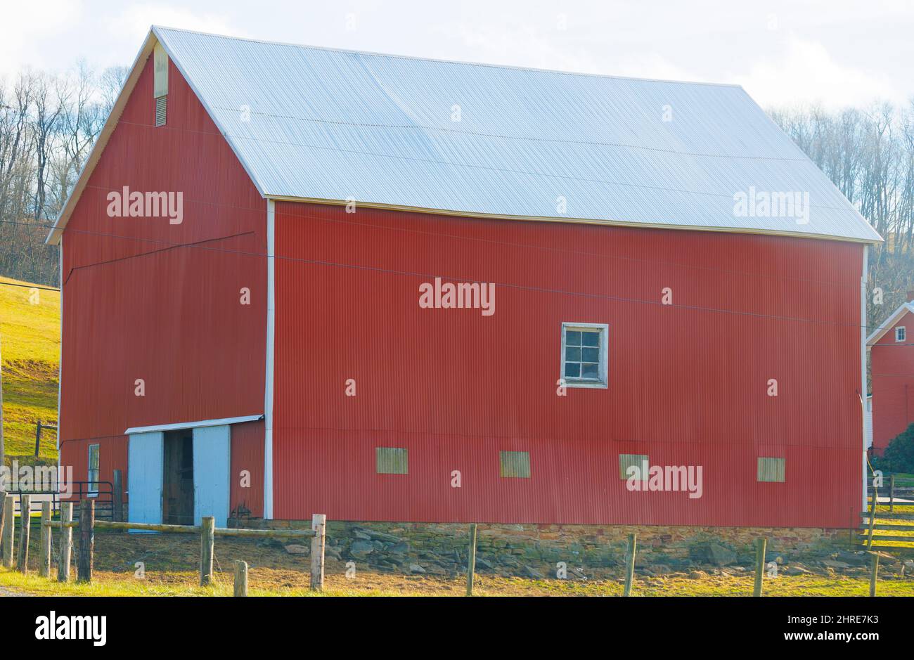 Beautiful view of a red Barn in a farm against a light sky Stock Photo ...