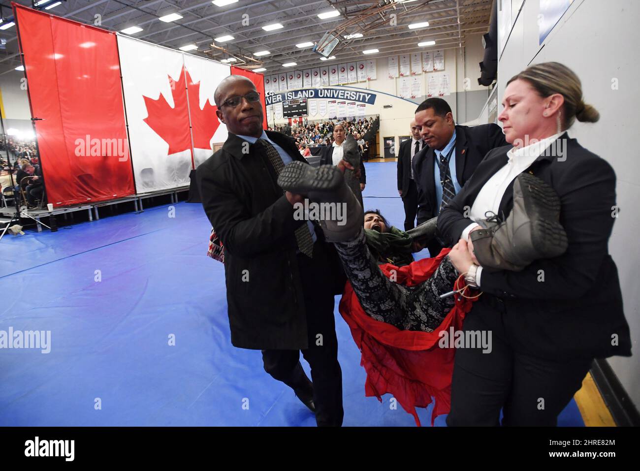 A protester is carried out of the building by police officers during a ...