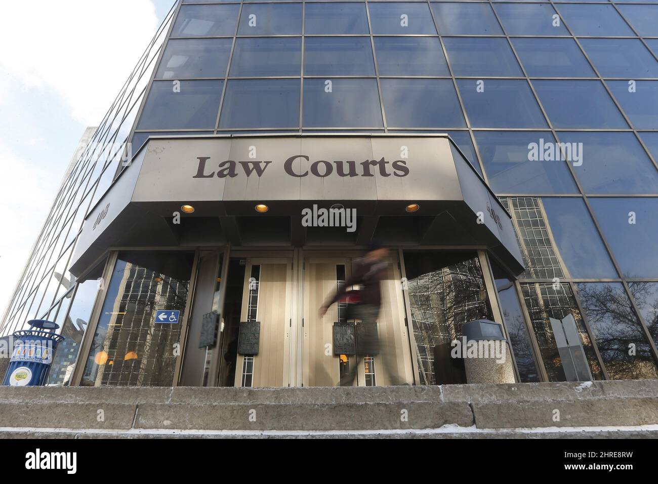 People enter the Law Courts in Winnipeg for the second degree murder ...