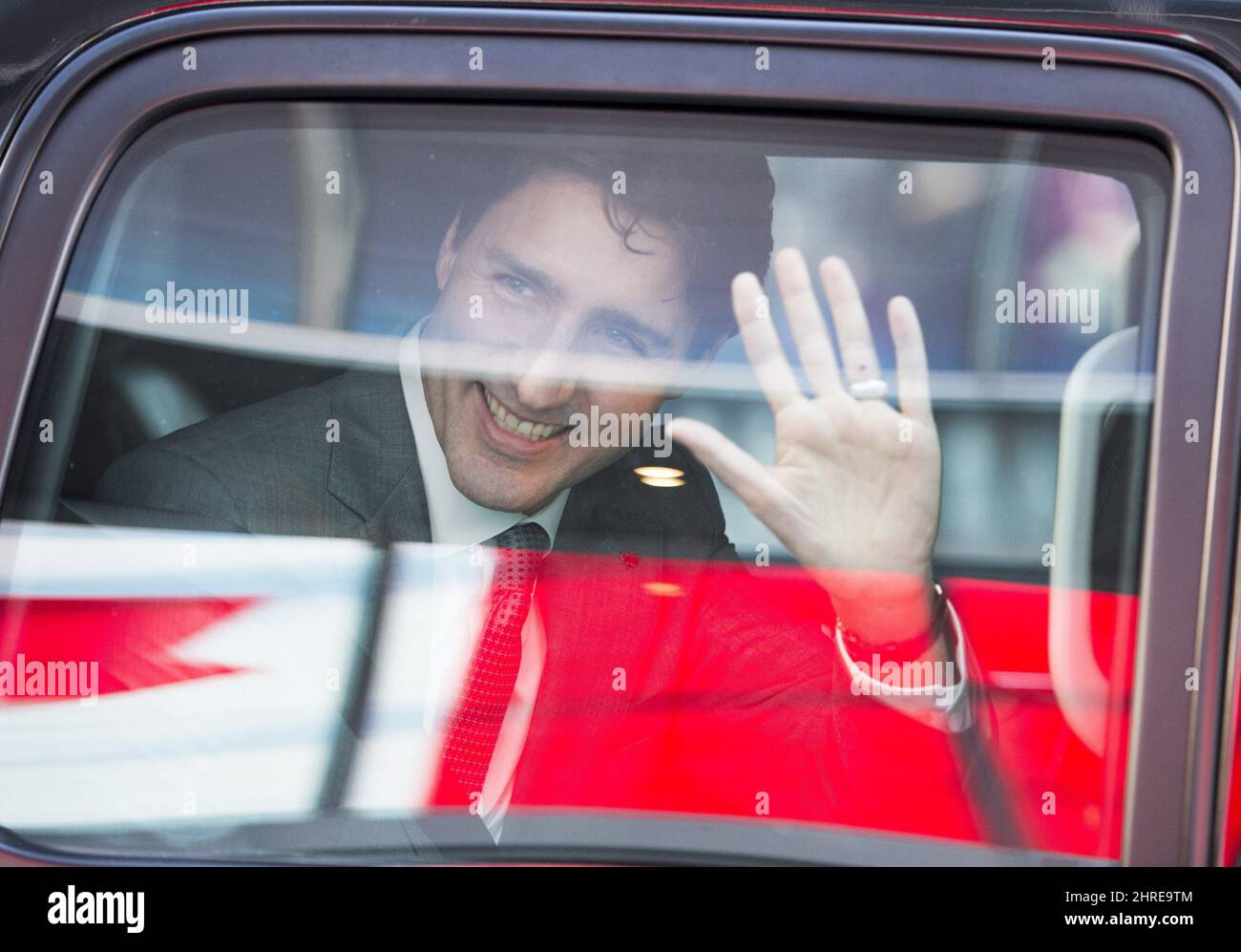 Prime Minister Justin Trudeau waves as he leaves the offices of ...