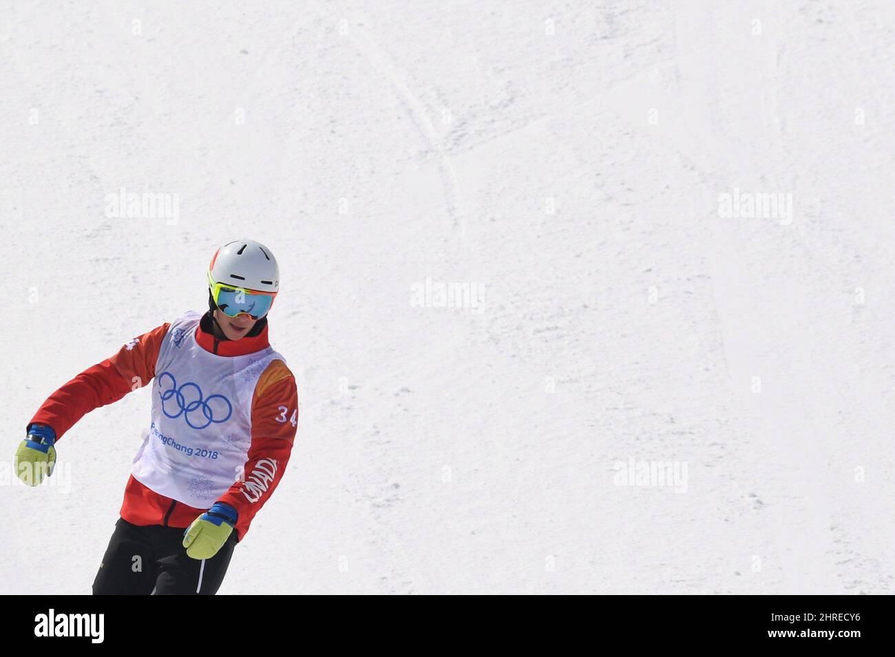 Canada's Eliot Grondin crosses the finish line after crashing in a men ...