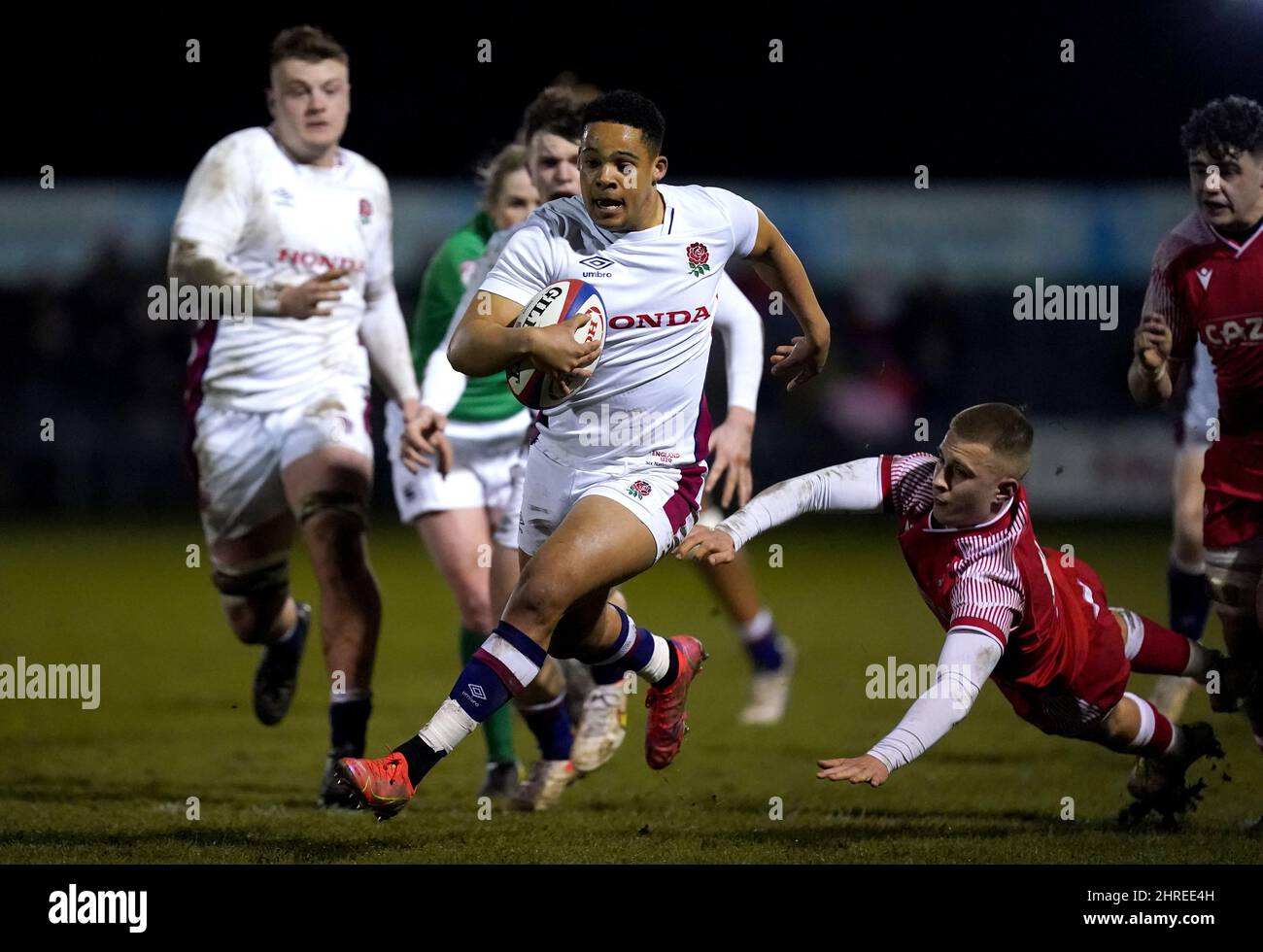 England's Cassius Cleaves gets away from Wales' Cameron Winnett during ...
