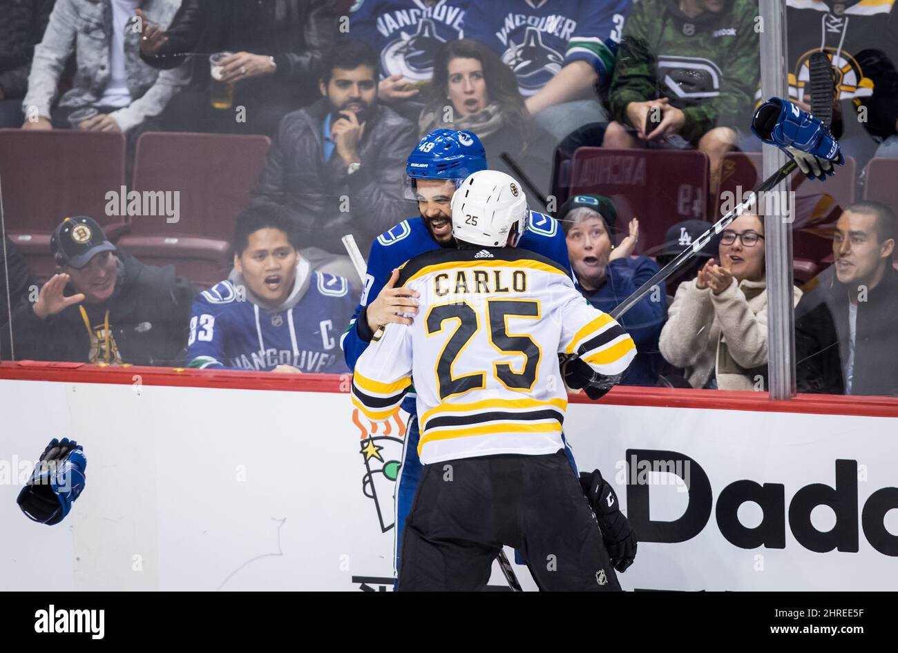 Vancouver Canucks' Darren Archibald, back, and Boston Bruins' Brandon ...