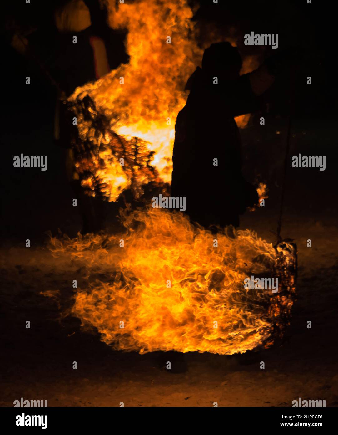 Swinging burning rice straw bags filled with charcoal at Hiburi ...