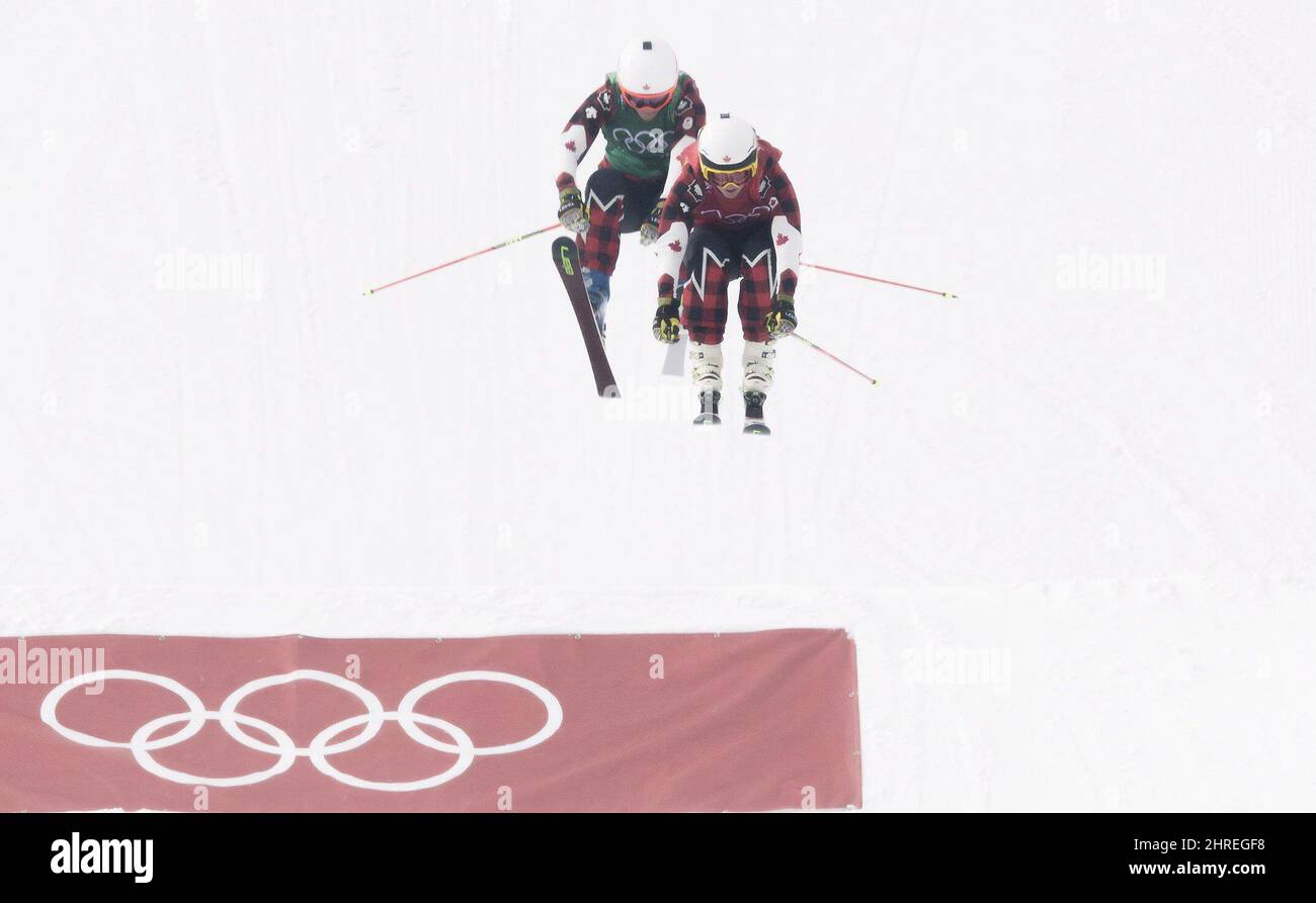 Canadian skiers Kelsey Serwa, right, and Brittany Phelan race to the ...